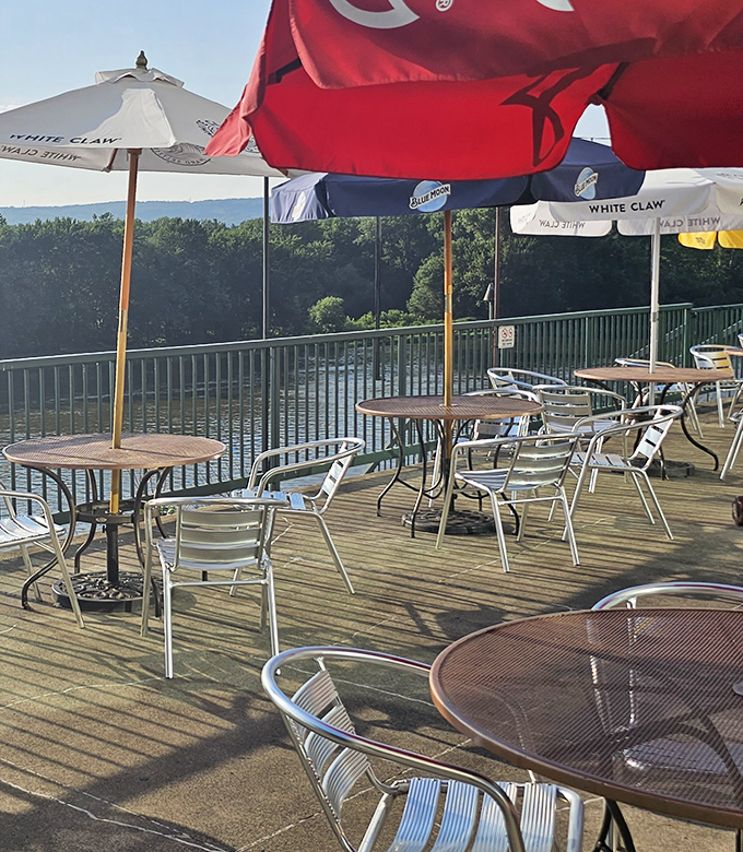 Riverside dining with umbrellas standing guard against too much sunshine&mdash;nature's perfect dining companion.
