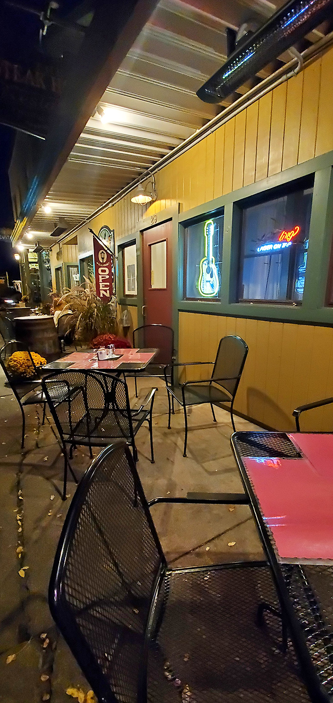 Nighttime dining al fresco, where the neon glow meets autumn air. These tables have witnessed countless first dates, anniversaries, and "just because" celebrations.