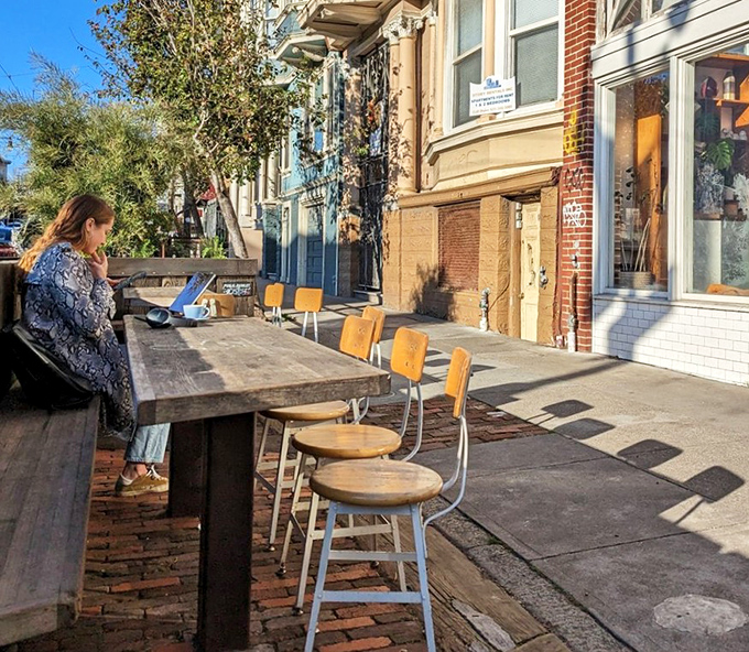 Sidewalk seating that turns people-watching into an Olympic sport. The perfect spot to contemplate life's big questions while demolishing small mountains of toast.