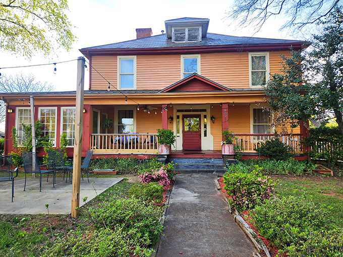The Victorian exterior with wraparound porch suggests Sunday dinners with family, even if you're dining with strangers.