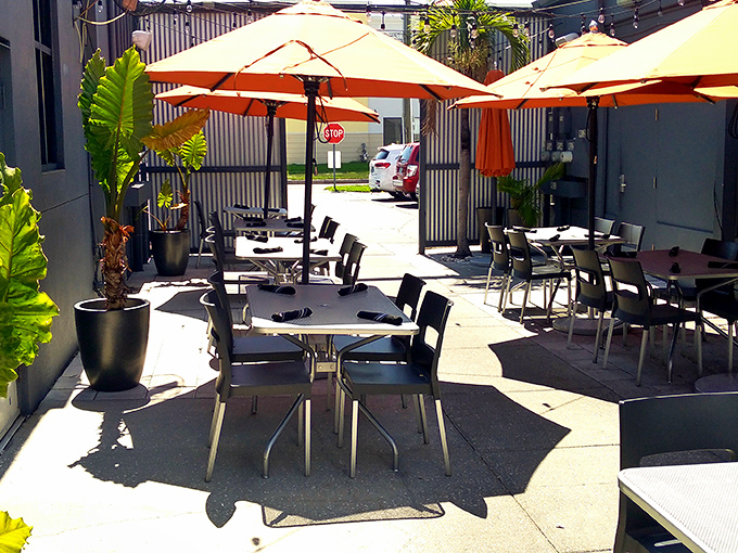Florida sunshine and orange umbrellas create the perfect outdoor laboratory for enjoying Edison's culinary experiments al fresco.