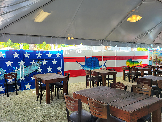 American flag backdrop, wooden tables, and fresh air—patriotism never tasted so good or came with such comfortable chairs.