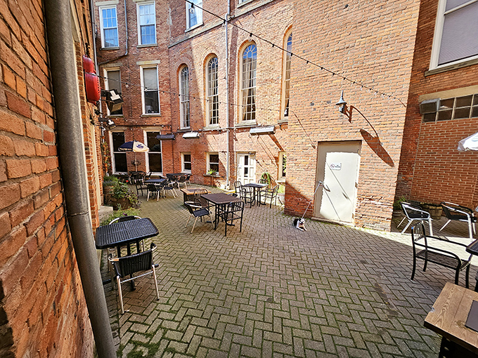 The courtyard where fresh air enhances fresh beer. Even brick walls seem to relax in this outdoor oasis of sips and stories.