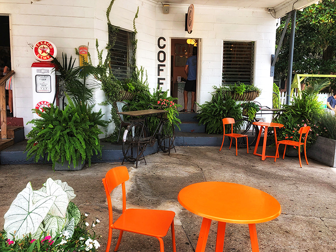 The outdoor coffee area with its vibrant orange furniture creates a perfect spot to sip and savor while contemplating your next cider purchase.