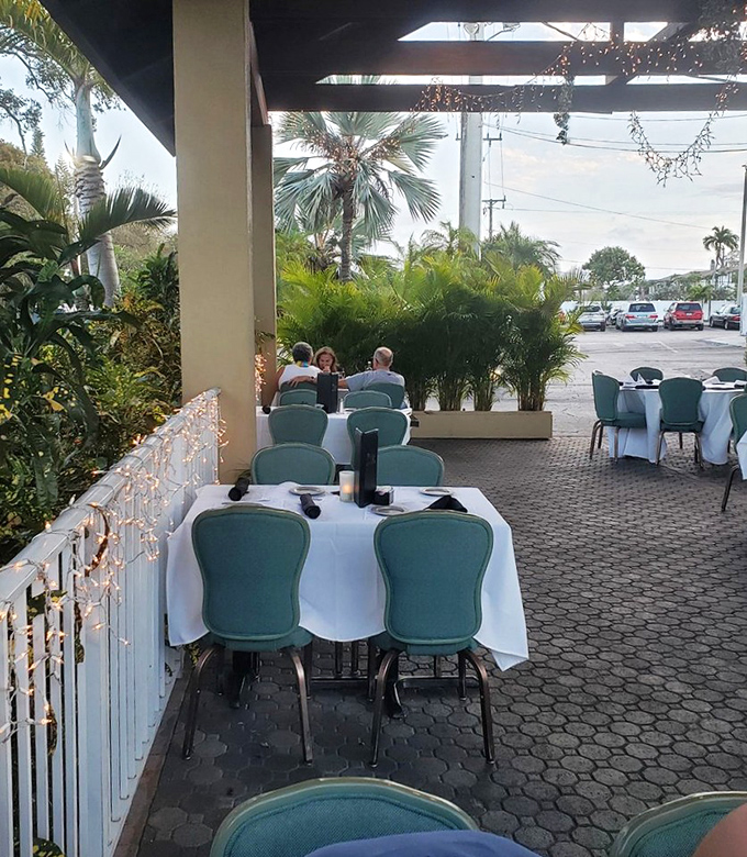 Al fresco dining with palm trees and Florida breezes&mdash;because sometimes the best seasoning is fresh air and twilight.