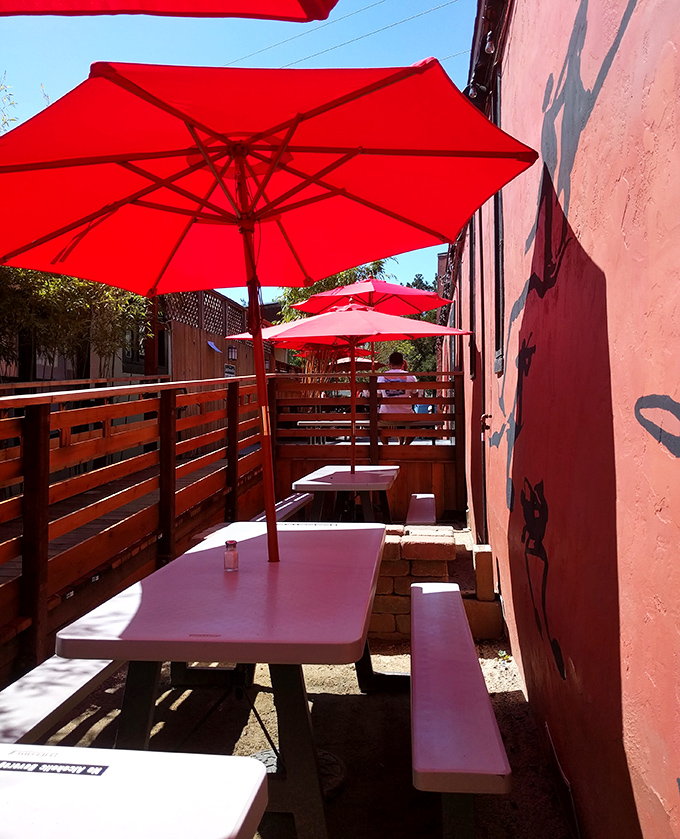 The outdoor patio's red umbrellas create little islands of shade where summer lunches stretch lazily into afternoon conversations.