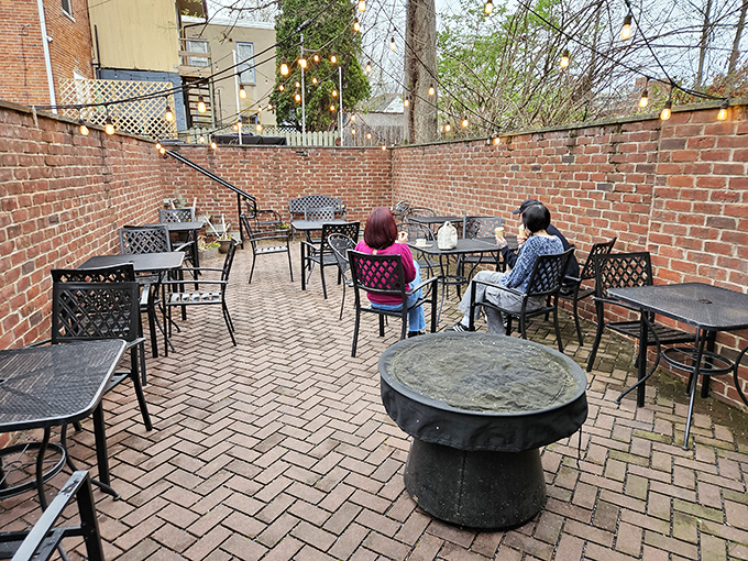 The brick-walled courtyard offers a peaceful retreat where ice cream contemplation becomes a serious afternoon activity.