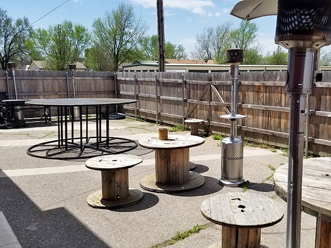 The outdoor patio features cable spool tables&mdash;ingenious upcycling that feels perfectly at home in this rural Kansas gem.