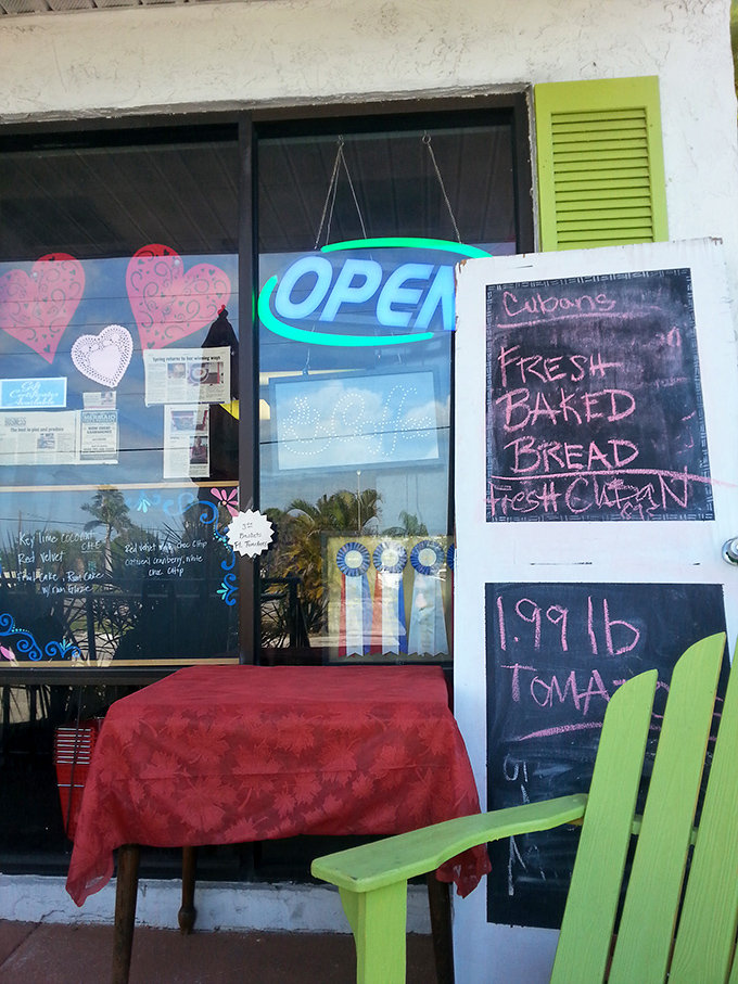The entrance says "OPEN" but what it really means is "Your diet plans end here." That chalkboard promising fresh bread seals the deal.
