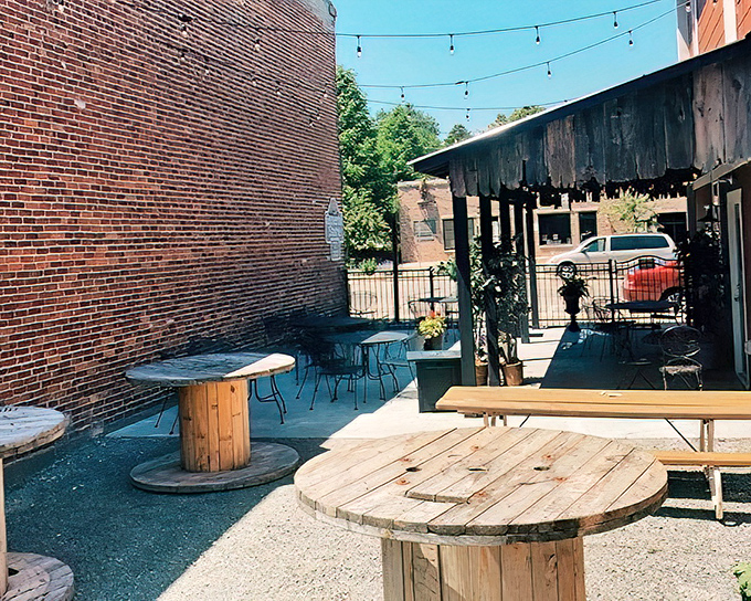 Summer in Wisconsin means outdoor seating where string lights twinkle above wooden spools repurposed as tables&mdash;small-town ingenuity at its finest.
