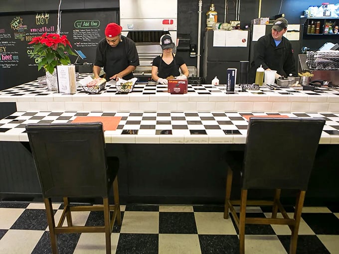 The sandwich assembly line in action – where bread becomes canvas, ingredients become art, and lunch becomes an experience worth writing home about.