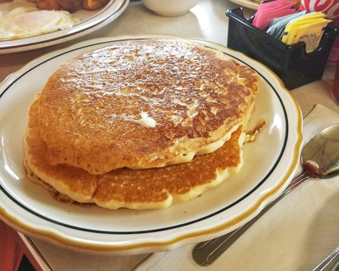 These aren't just pancakes; they're fluffy golden discs of happiness that make maple syrup feel like it's found its soulmate.