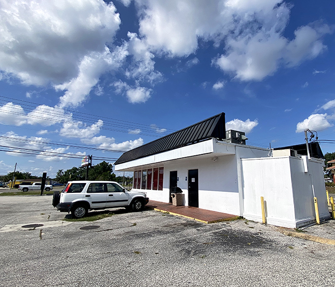 Even the parking lot has that perfect no-nonsense charm that says, "We put our energy into the chicken, not into impressing you with fancy landscaping."