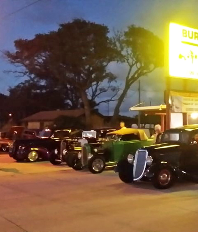 Classic cars gathering under the glow of the Burger Inn sign&mdash;a scene Norman Rockwell would've painted if he'd had a serious craving for onion rings.