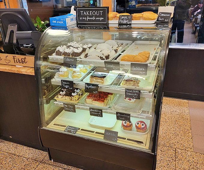 The dessert case—where good intentions go to die. That "I'll just have coffee" resolve crumbles faster than their homemade coffee cake.