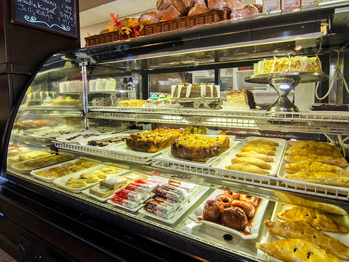 Pastry case displaying sweet temptations that make choosing dessert feel like the most important decision of your day.