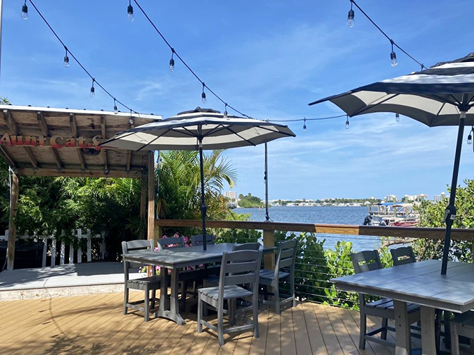 Outdoor dining with string lights and water views&mdash;because sometimes the best seasoning is fresh air and the gentle reminder that you're not at work.