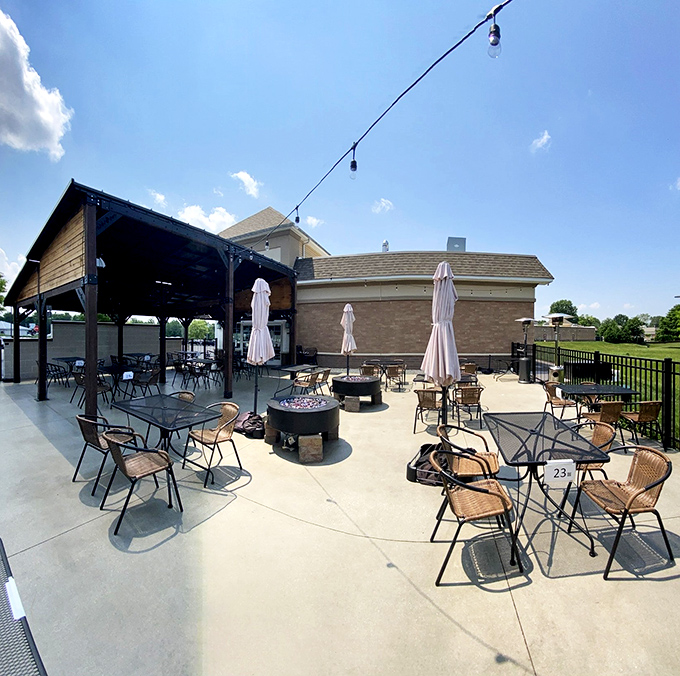 The outdoor patio beckons with the promise of fresh air, cold beer, and the kind of conversations that stretch pleasantly into evening.