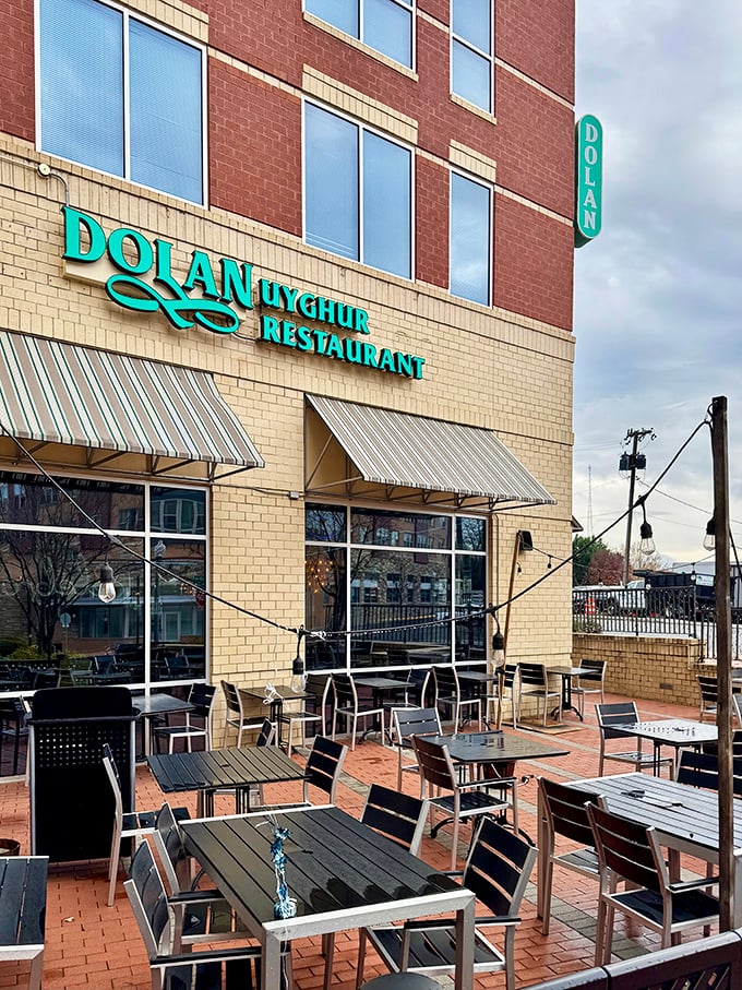 The outdoor patio offers al fresco dining beneath the distinctive turquoise sign&mdash;a perfect spot for people-watching while savoring Central Asian delights.
