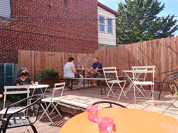 The secret garden patio where summer afternoons stretch into evening, and strangers at neighboring tables become friends over shared desserts.
