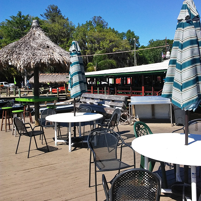 Outdoor seating that captures the essence of Florida living: thatched umbrellas, water views, and the promise of seafood bliss.