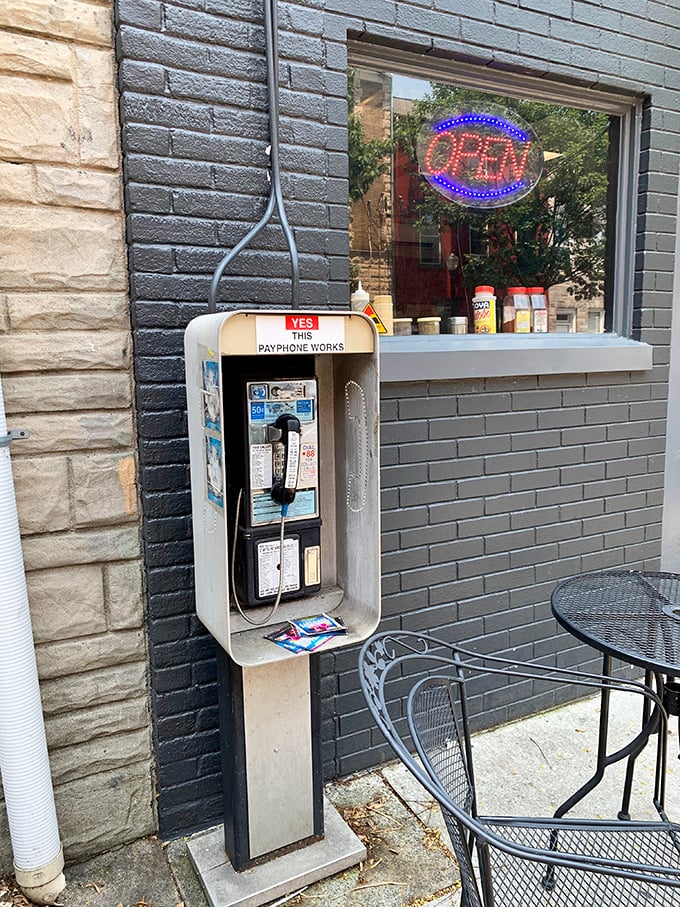 Even the payphone outside seems nostalgic, like it's waiting for someone to call in their order from 1995. Some places preserve their charm effortlessly.