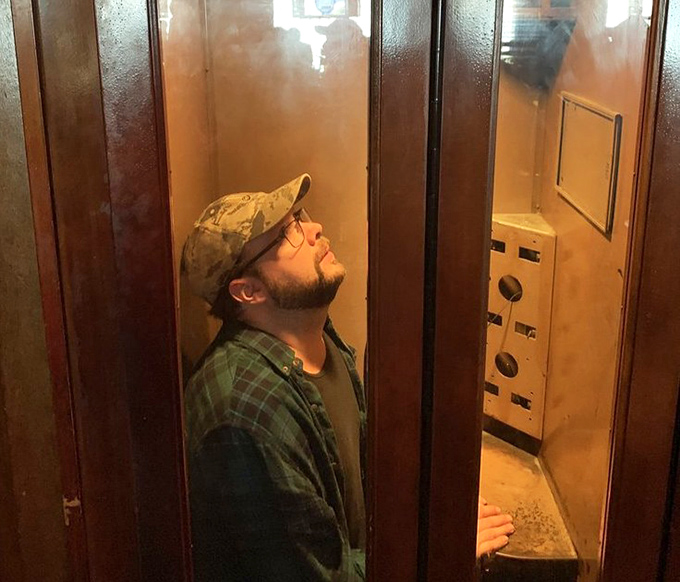 Every great tavern has its quirks. At Slyder's, the vintage phone booth stands as a charming reminder of simpler, pre-smartphone times.