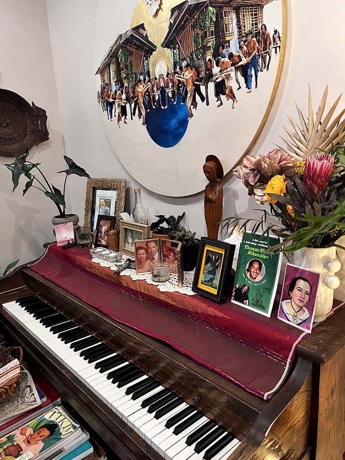 "The piano corner – where family photos and cultural treasures create a shrine to heritage that's as important to Kaya as what's on your plate."