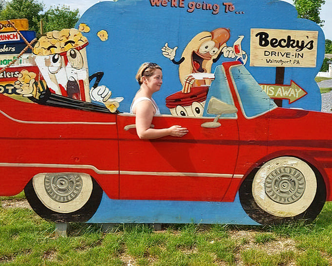 The photo op cutout lets visitors star in their own drive-in adventure before the real show begins.