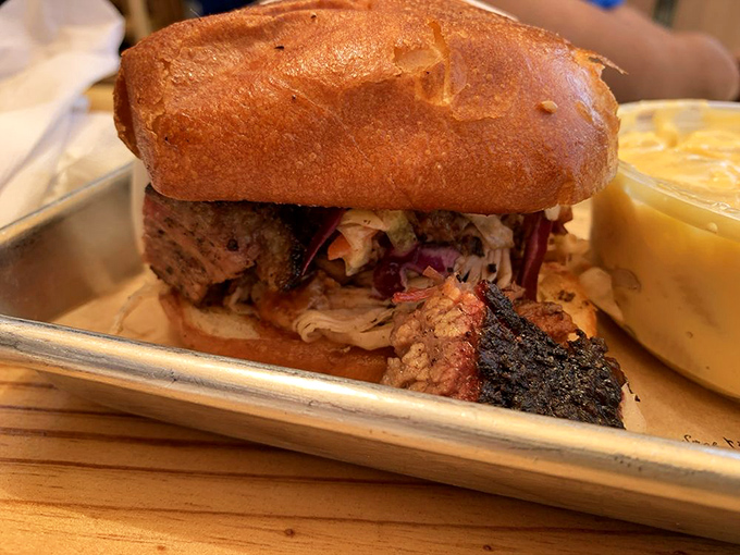 A sandwich that requires both hands and your full attention. That bark peeking out is sending smoke signals to your taste buds.