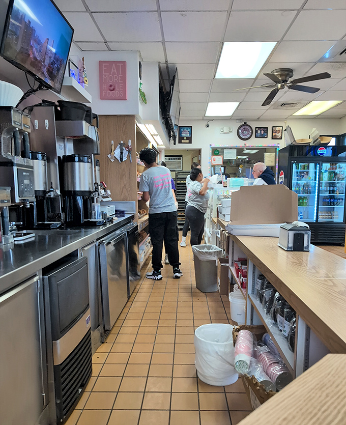 Behind the scenes where the magic happens. Even the ceiling fan seems excited to be in the presence of such donut-making greatness.