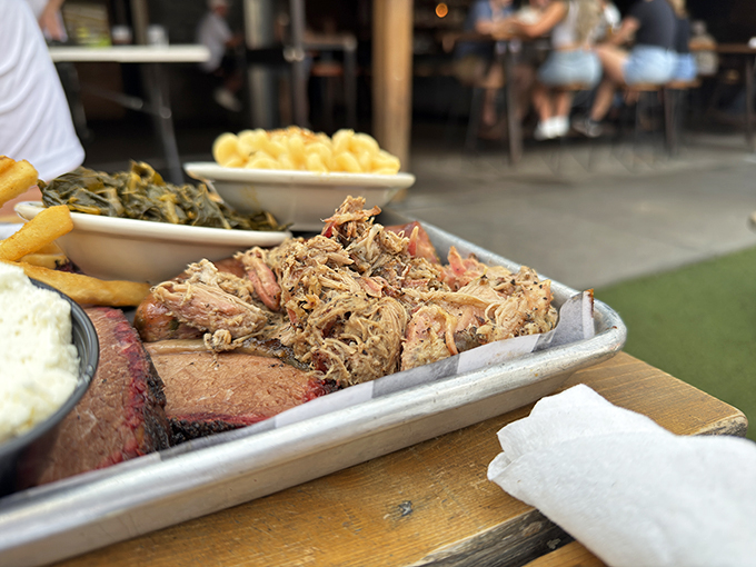 This tray of pulled pork and brisket isn't just food—it's edible art. The kind of masterpiece that makes you pause before diving in... but only for a second.