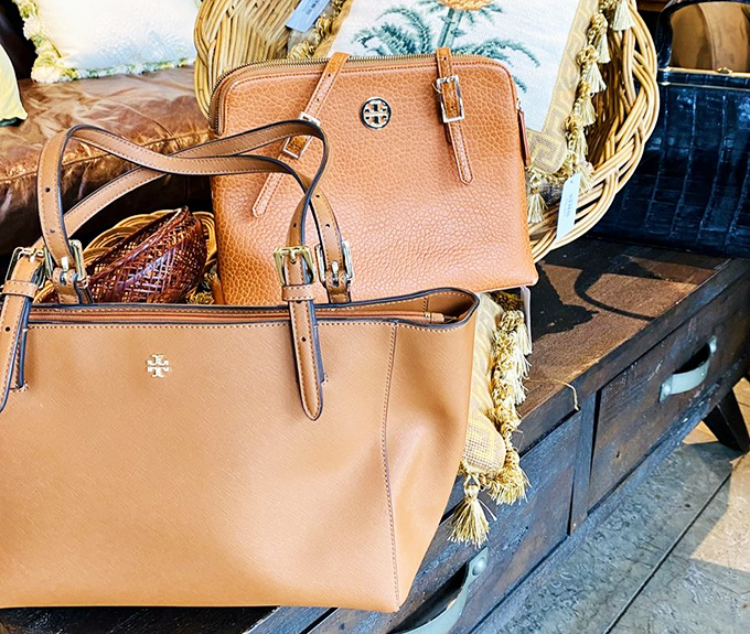 Designer bags that didn't get the memo they're supposed to be unaffordable. That Tory Burch tote probably cost less than your last dinner delivery.