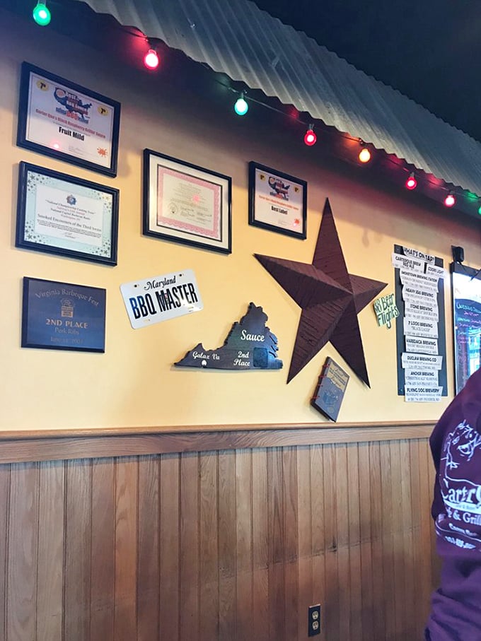 Wall of fame that tells the story of barbecue excellence. Those awards aren't just decoration – they're spoiler alerts for your taste buds.