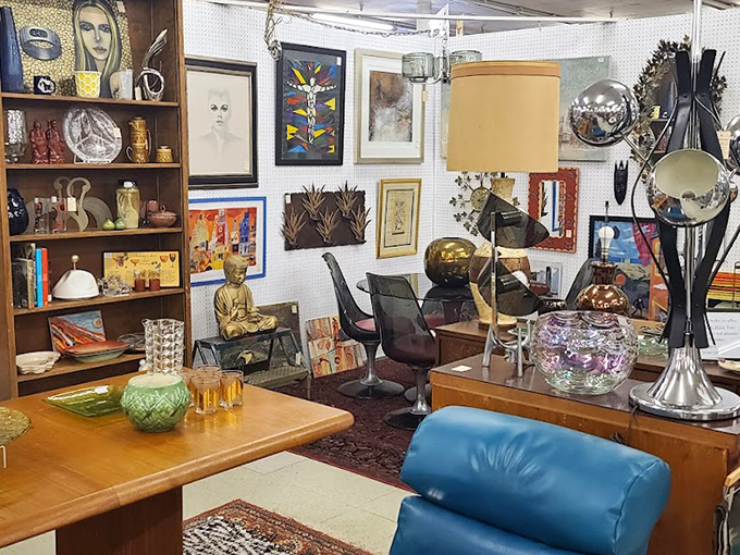 Mid-century modern meets artistic flair in this curated booth. That blue leather chair has "Mad Men" vibes and stories it's not quite ready to tell.