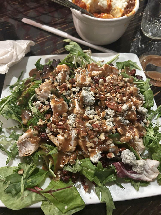 This isn't just a salad—it's a garden party where greens, nuts, cheese and protein have gathered to celebrate good taste.