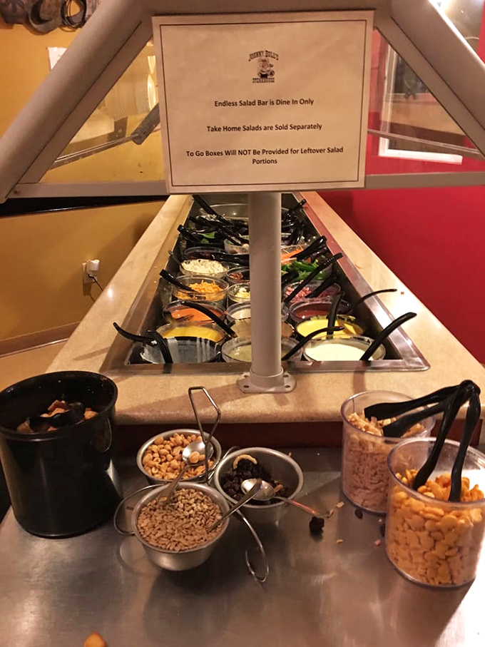 The salad bar stands ready for battle, armed with fresh ingredients and enough toppings to make vegetables an event rather than an obligation.