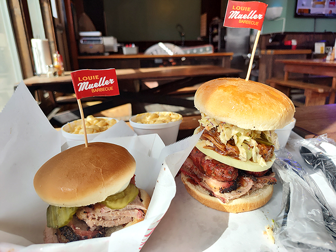 Sandwiches that require both hands and a strategy. These towering creations prove that sometimes the best way to enjoy barbecue is between two buns.