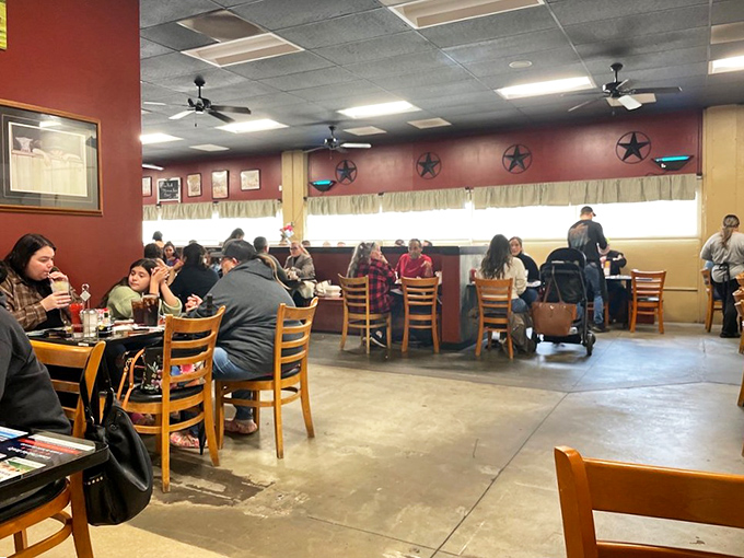 Where strangers become neighbors over scrambled eggs. The dining room hums with conversation and the promise of good food.