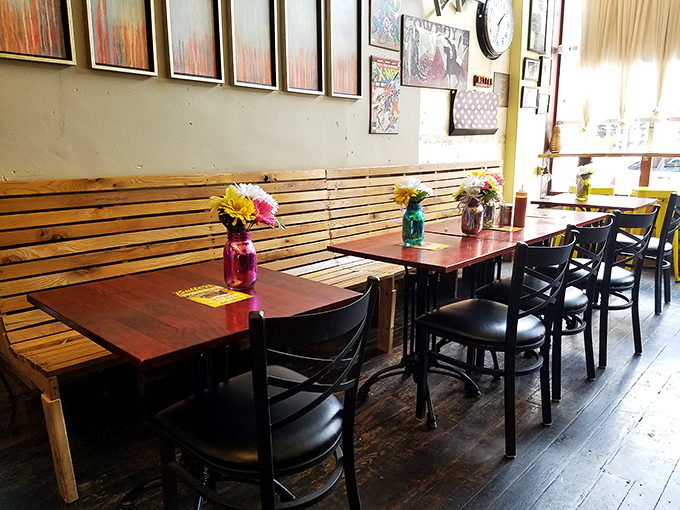 Cheerful flowers brighten communal tables where strangers become friends over shared plates of comfort.