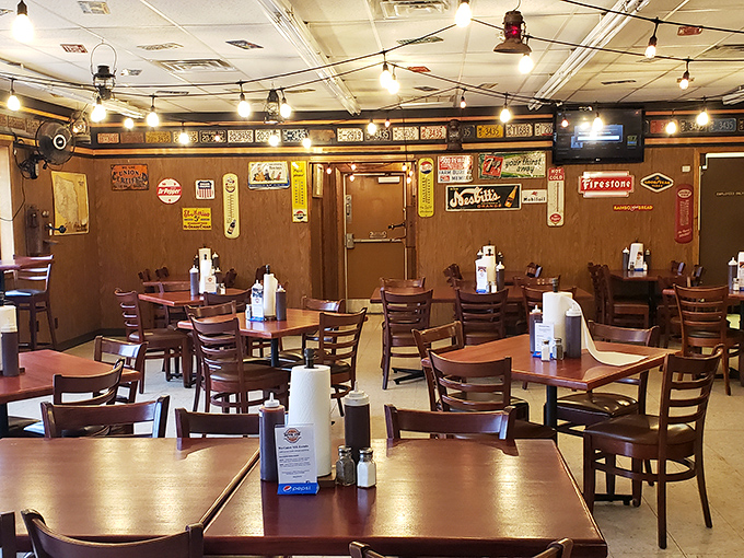 The dining room has that perfect "focus on the food" vibe. Those vintage signs aren't decoration&mdash;they're the previous generation's Yelp reviews.