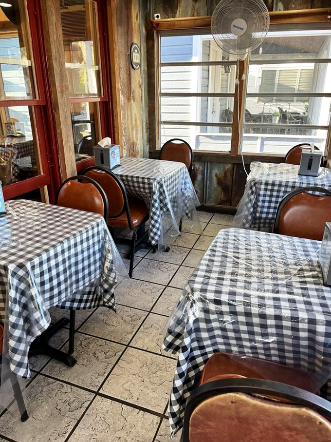 Checkered tablecloths and wood paneling create the perfect backdrop for serious barbecue consumption and casual conversation.