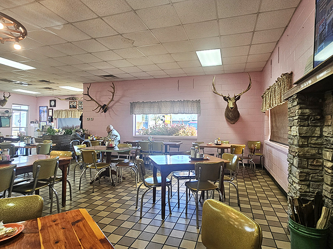 The dining room's pink walls, mounted deer, and classic tables create an atmosphere where time stands still and conversations flow as freely as the coffee.