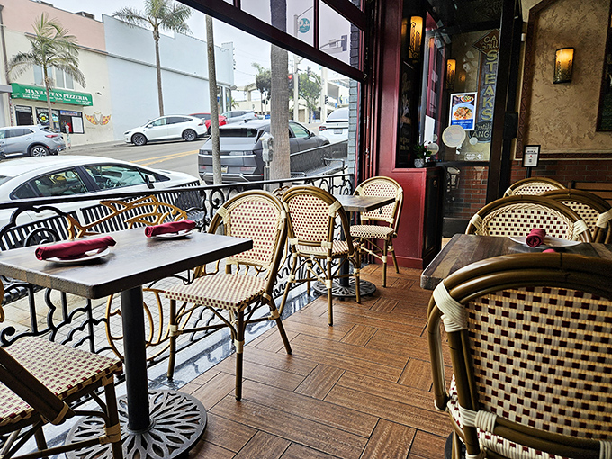 Bistro-style seating with woven chairs that whisper "stay awhile." This isn't just a meal&mdash;it's a Mediterranean-inspired California afternoon.