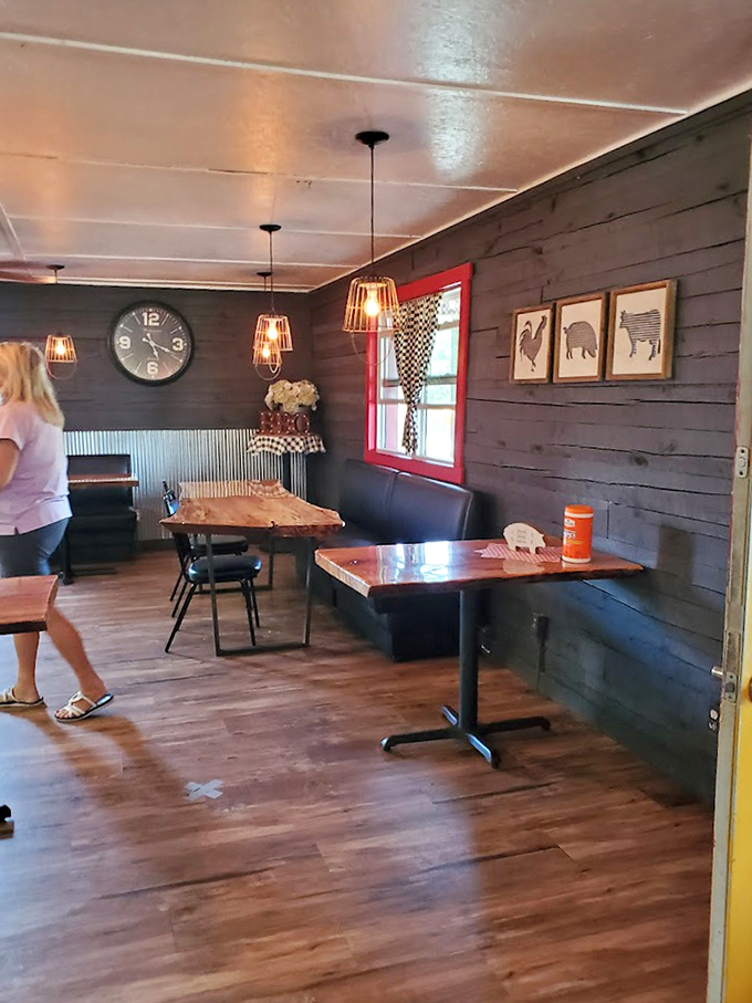 Rustic wooden tables beneath cage lights create the perfect stage for the real stars of the show &ndash; whatever smoked delights are about to grace your plate.