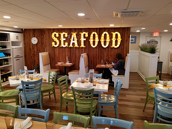 The dining room's wood-paneled charm and seafoam chairs create an atmosphere that says, "Relax, you're about to experience something special."