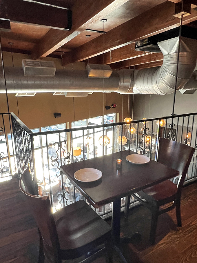 Second-floor seating offers a bird's-eye view of the dining room below &ndash; perfect for romantic dinners or discreet people-watching.