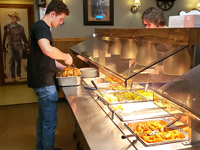 Where hot food waits patiently behind glass shields, like culinary performers ready to take their starring role on your plate.