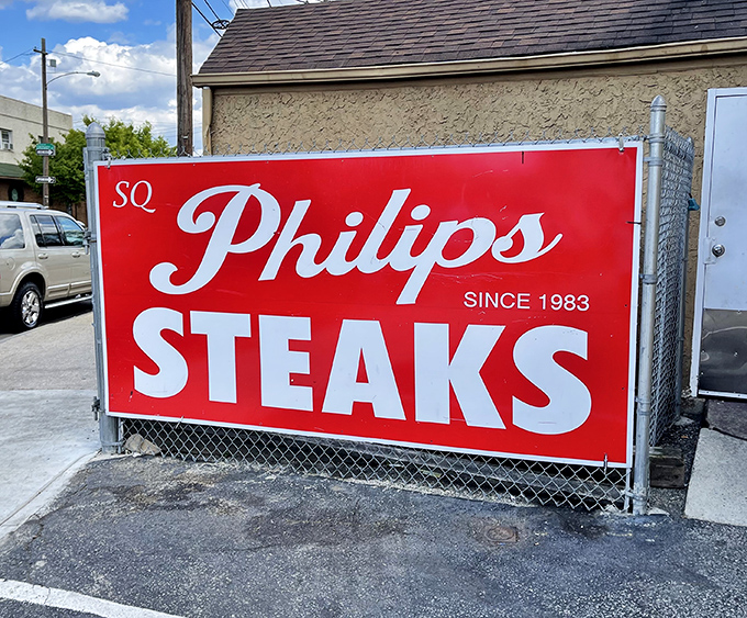 The sign says it all: STEAKS, PORK, HOAGIES. No need for fancy adjectives when your reputation speaks for itself.