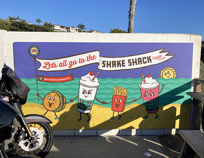 This mural doesn't just advertise&mdash;it captures the spirit of Crystal Cove's beachside joy. Those cartoon milkshakes are living their best lives.